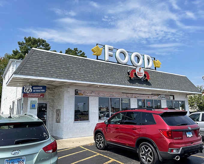 The Cozy Dog Drive In's simple white exterior belies its significance as a Route 66 landmark and birthplace of the corn dog on a stick.