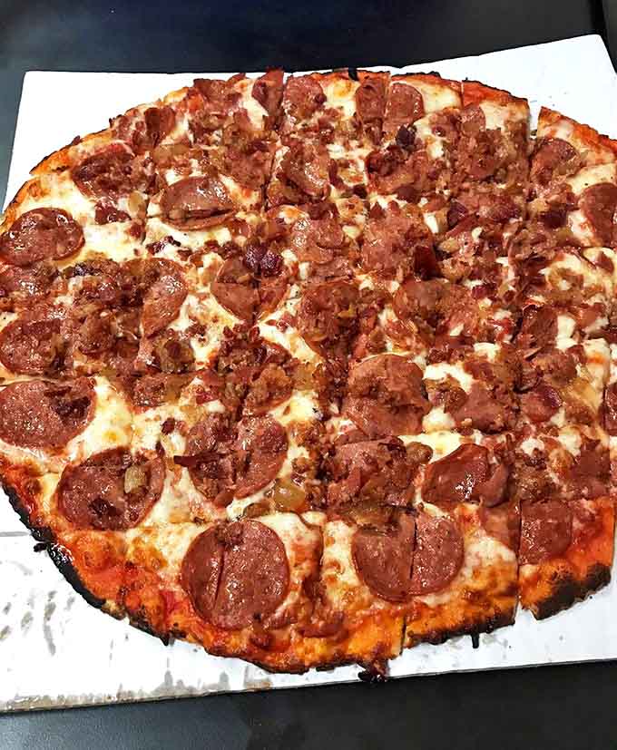 Not so much a pizza as a carnivore's manifesto – a bold statement that sometimes more really is more when it comes to meat toppings.