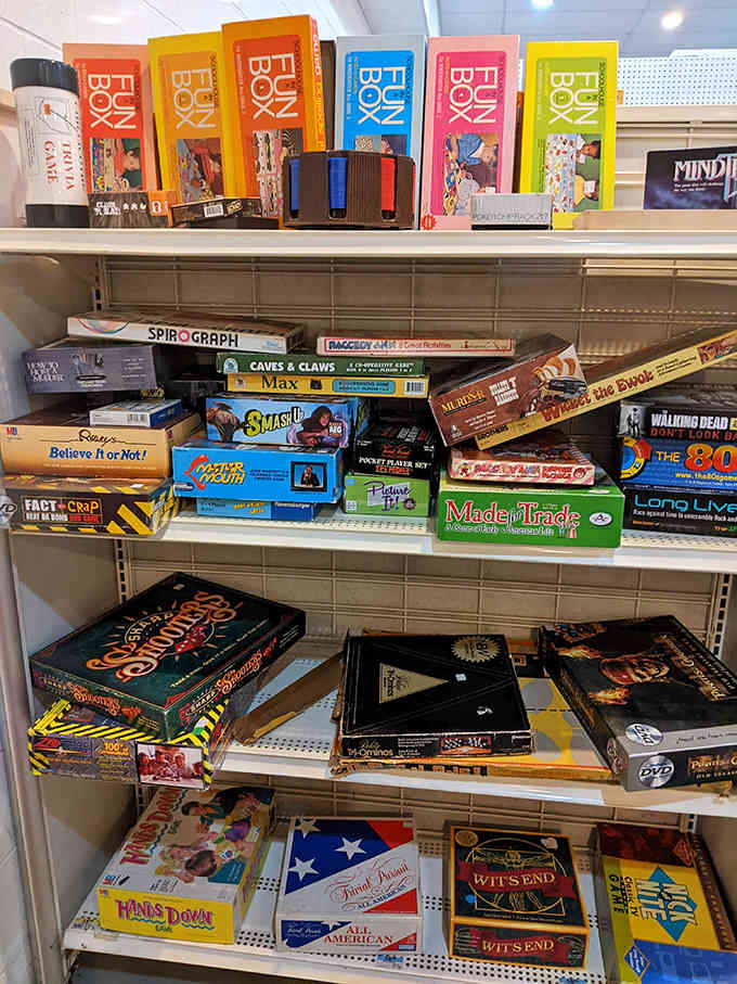 Vintage board games stack like a tower of family memories, their worn boxes containing not just cardboard and plastic pieces, but countless evenings of laughter and competition.