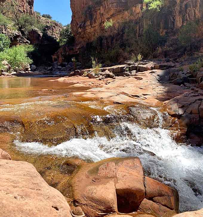 The stream that's been carving this masterpiece for millennia, one persistent trickle at a time.