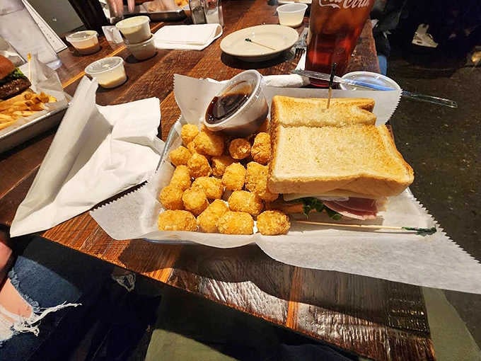 15. club sandwichaThe skyscraper of sandwiches! This towering creation with golden tots on the side is the architectural marvel of lunch options.