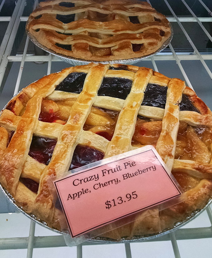 The "Crazy Fruit Pie" lives up to its name by rebelliously combining apple, cherry, and blueberry in one magnificent, lattice-topped creation.