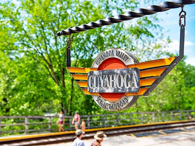 The iconic Cuyahoga Valley Scenic Railroad emblem swings gently in summer breeze. This distinctive logo has become synonymous with Ohio's most beloved rail adventure.