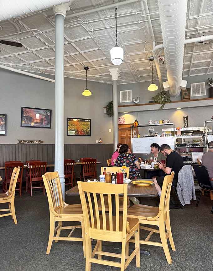 Conversations flow naturally between tables as neighbors catch up, creating the soundtrack of a true community gathering spot.