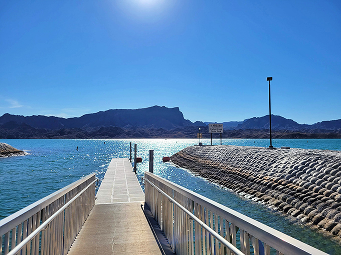 The park's boat dock extends like an invitation into the clear waters, beckoning visitors to venture beyond the shore and explore the lake.
