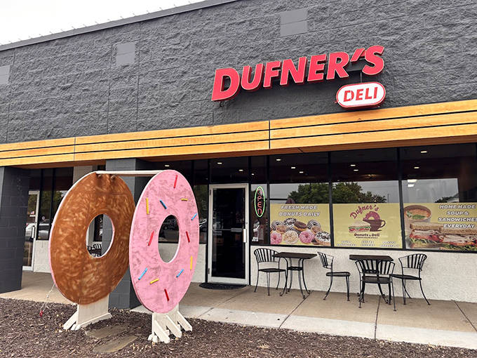 Giant donut sculptures guard the entrance like delicious sentinels, a whimsical welcome that perfectly captures Dufner's playful spirit.