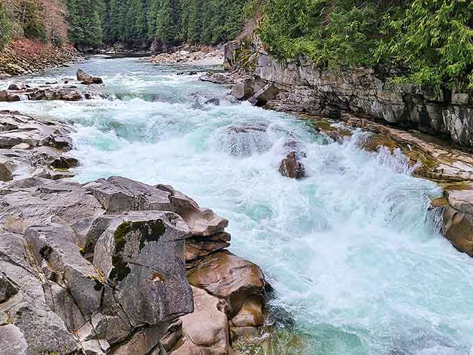 Eagle Falls rushes with untamed energy over ancient rocks, creating nature's own symphony of splashing water and misty air.