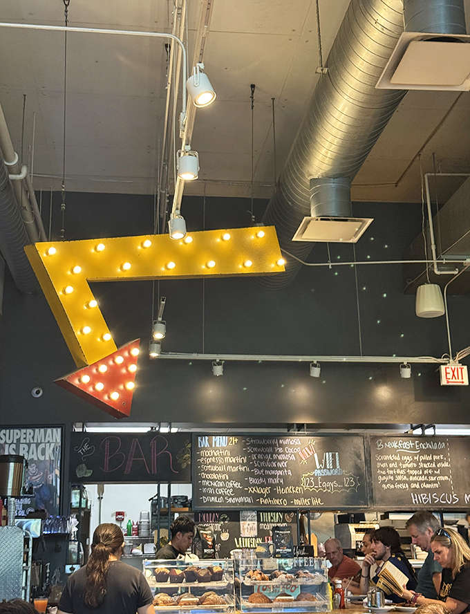 That glowing arrow sign points the way to breakfast happiness, like a delicious North Star guiding hungry travelers home.