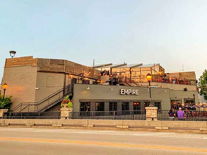 Empire Burgers + Brew's rooftop patio offers the perfect perch for people-watching while savoring craft beers and gourmet burgers.
