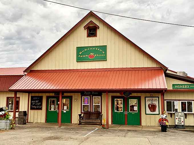 The charming exterior with its red metal roof and country store vibe practically whispers, "Your diet plan ends here, but the memories are worth it."