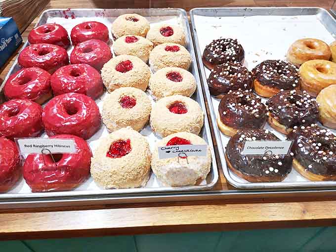 Red Raspberry Hibiscus donuts alongside their Cherry Cheesecake cousins &ndash; proof that donuts can be both sophisticated and playful simultaneously.