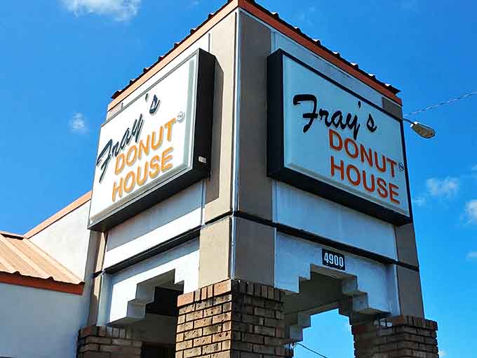 The Fray's Donut House sign stands as a beacon of hope for the hungry. Against that blue Florida sky, it promises sweet relief from ordinary breakfasts.