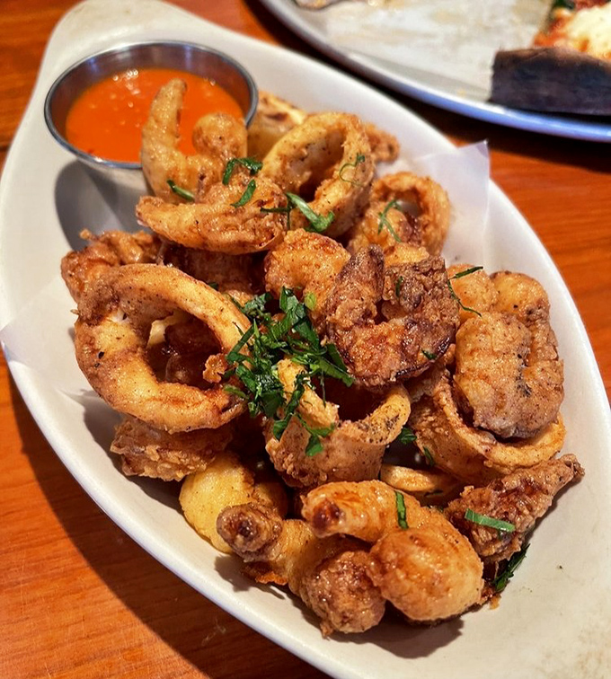 The Fritto Misto delivers golden-fried perfection &ndash; each bite offering a satisfying crunch before yielding to tender seafood within.