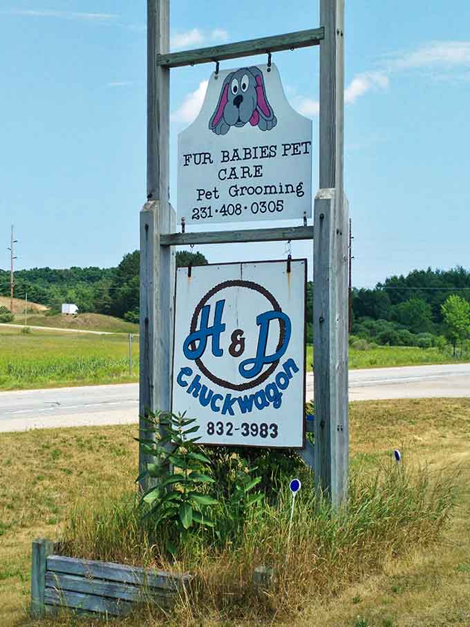 The roadside sign stands as a humble invitation to one of Michigan's sweetest hidden gems, beckoning travelers to discover what locals already know.