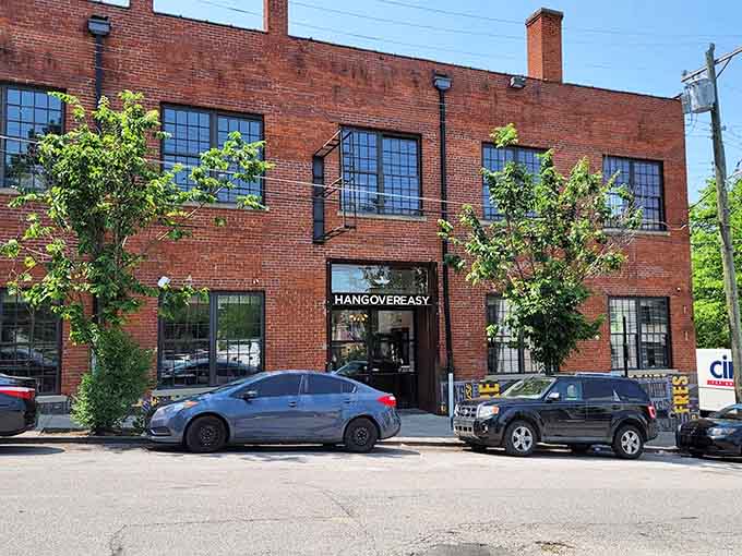 The full brick building exterior shows this converted industrial space has serious character and curb appeal.