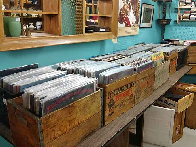 Vinyl records wait patiently in wooden crates, ready to spin again and remind us when album art mattered as much as the music.