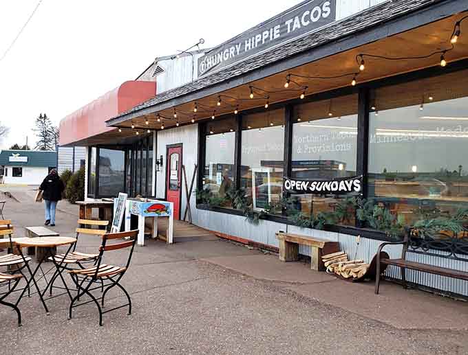 The outdoor patio beckons diners to enjoy their meals al fresco, with string lights creating ambiance as the sun sets.