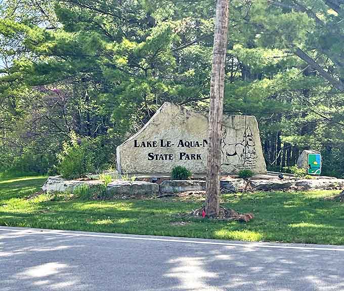 The park entrance marker stands ready to greet visitors, silently judging those who drive past without stopping to explore.