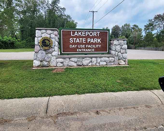 The welcoming entrance sign announces your arrival at Lakeport State Park, where Lake Huron's coastal magic awaits just beyond.