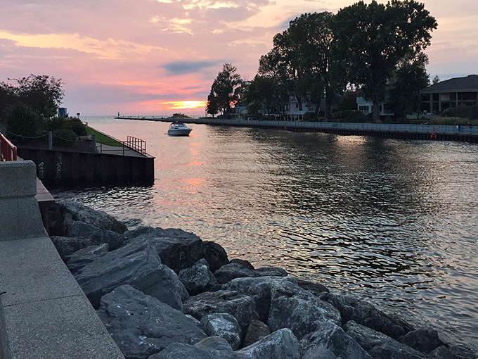Twilight softens the edges of South Haven's harbor, where the day's last light paints the water in shades impossible to capture but impossible to forget.