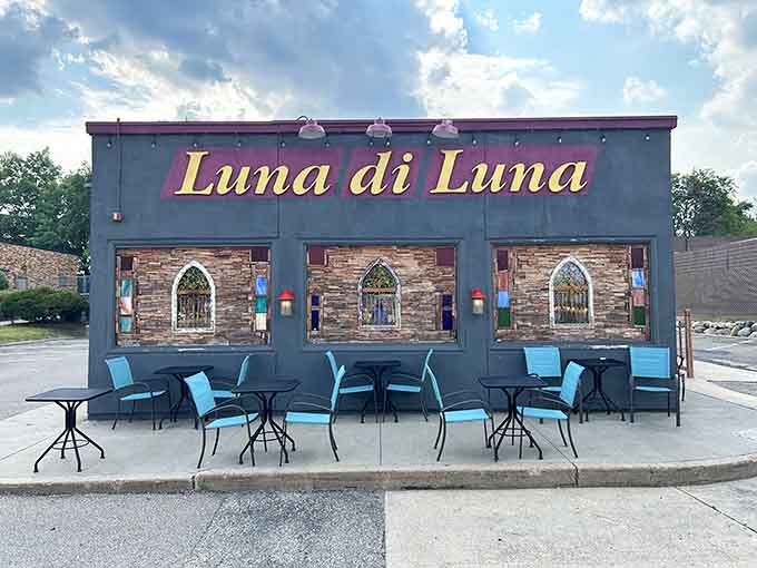 Outdoor seating with turquoise chairs and twinkling lights, perfect for pretending you're dining in Italy while actually enjoying Minnesota's finest.