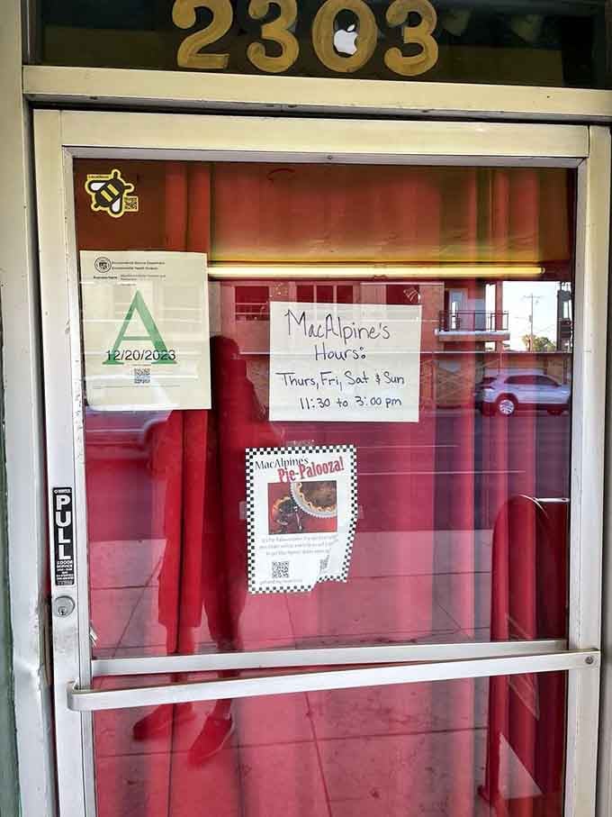 Operating hours posted old-school style, because sometimes the best information doesn't need an app or a website to be useful.