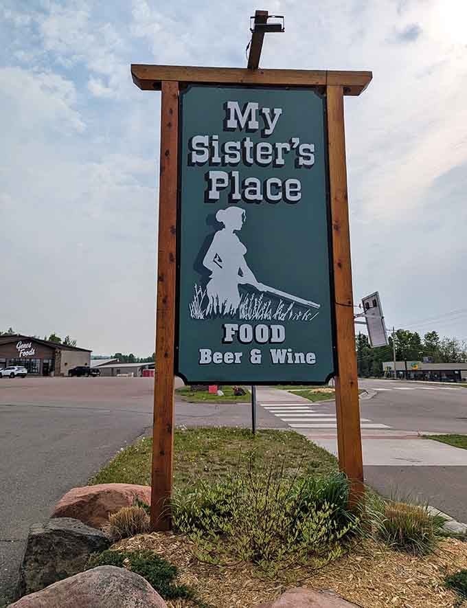The roadside sign beckons travelers with promises of food, beer, and wine, like a siren song for hungry road trippers.