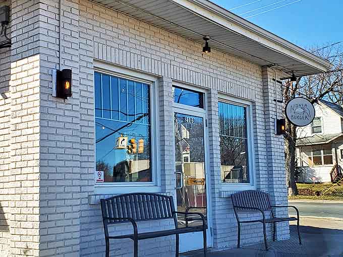 Entrance: Winter sunshine illuminates Nonla's entrance – a portal to a world where burger dreams come true year-round, regardless of Michigan weather.