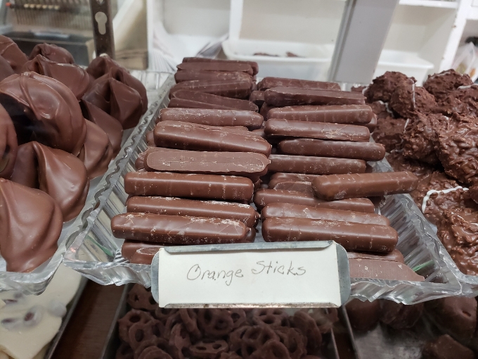 Orange sticks &ndash; sophisticated citrus zing wrapped in chocolate elegance, proving fruit can indeed be dessert.