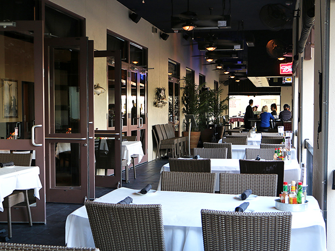 The outdoor patio offers al fresco dining under Florida skies, where sea-inspired cuisine tastes even better with a gentle breeze.