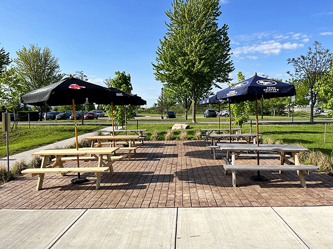 Outdoor seating transforms lunch into a Vermont pastoral experience &ndash; picnic tables under umbrellas with Green Mountain views.