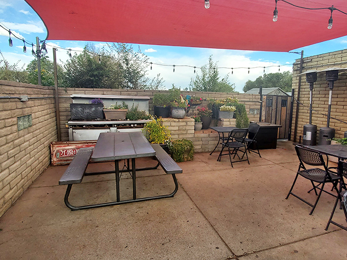 A cozy brick-walled patio where Arizona's blue skies provide the perfect ceiling for enjoying Cajun flavors in mountain air.