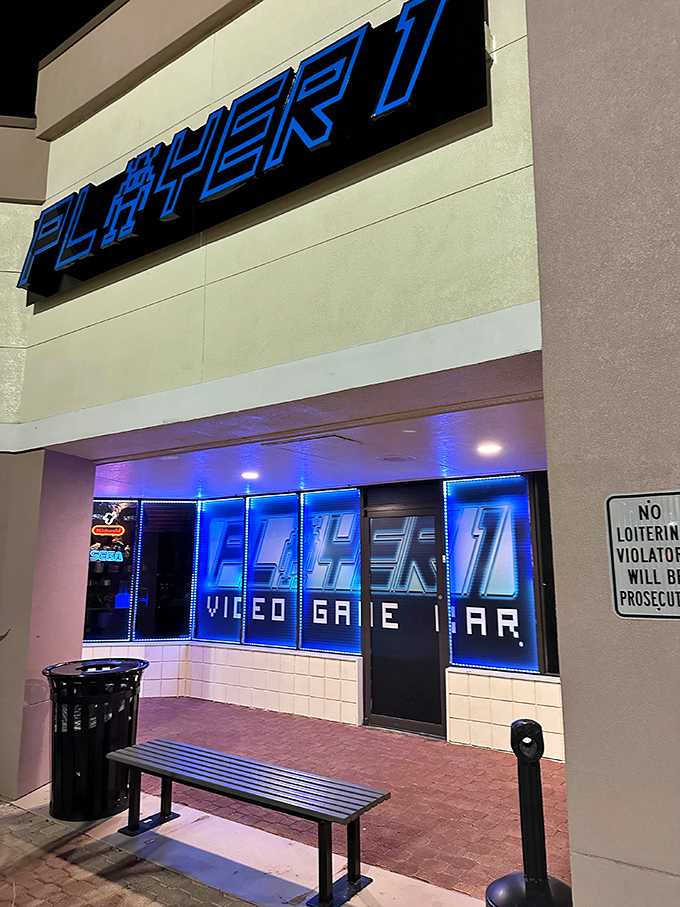 The welcoming entrance with its bench and blue-lit windows hints at the electronic wonderland waiting inside for gamers of all generations.