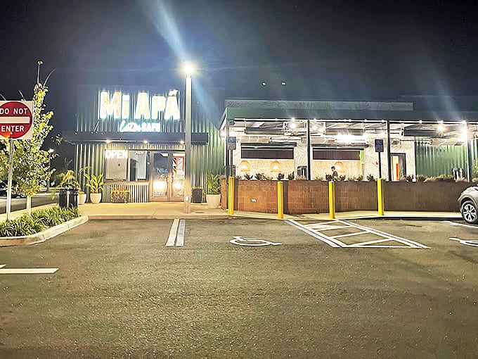 Even at night, the welcoming glow of Mi Ap&aacute; beckons hungry diners, promising authentic flavors that transcend the ordinary.