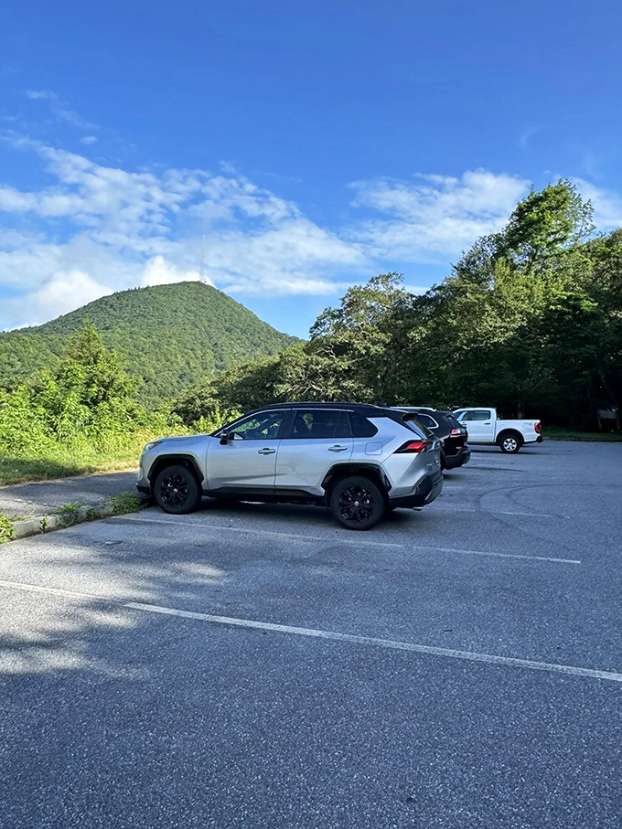 The journey begins here: Mount Pisgah's parking area sits quietly under the mountain's watchful gaze, awaiting your adventure.