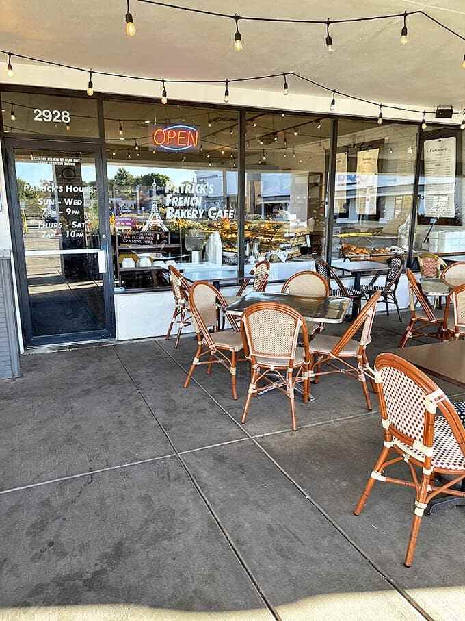 The outdoor seating area channels Parisian sidewalk caf&eacute; vibes, perfect for people-watching while savoring a croissant and caf&eacute; au lait.
