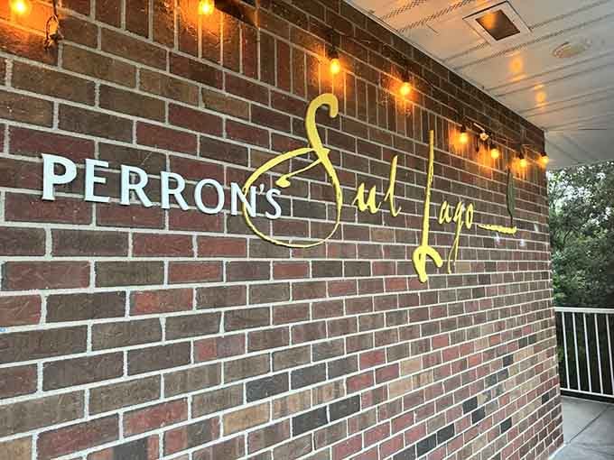 The elegant Perron's Sul Lago signage on brick announces you've arrived somewhere special, where serious food happens without taking itself too seriously overall.