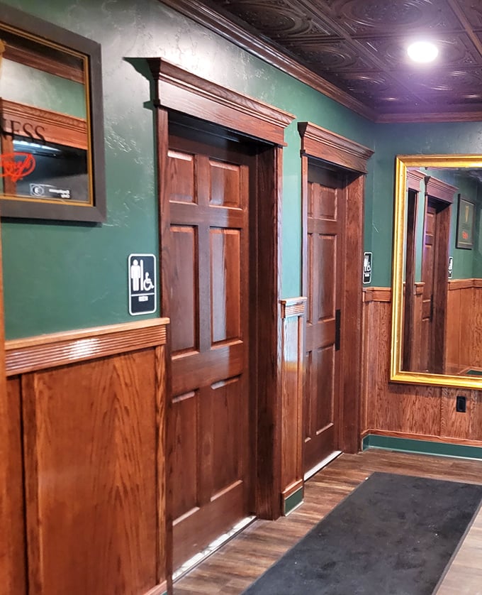 Rich wood doors and emerald walls create an atmosphere that's more authentic than your cousin's stories about their "wild college days."