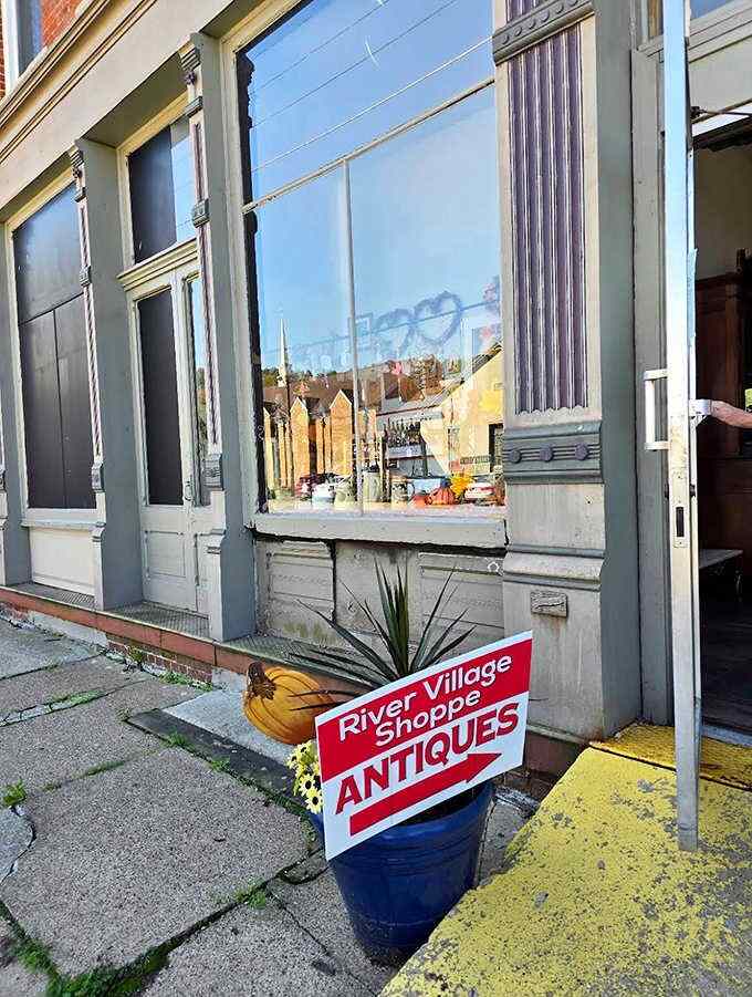 The welcoming storefront with its "ANTIQUES" sign promises treasure hunting of the highest order, a siren call to vintage lovers everywhere.