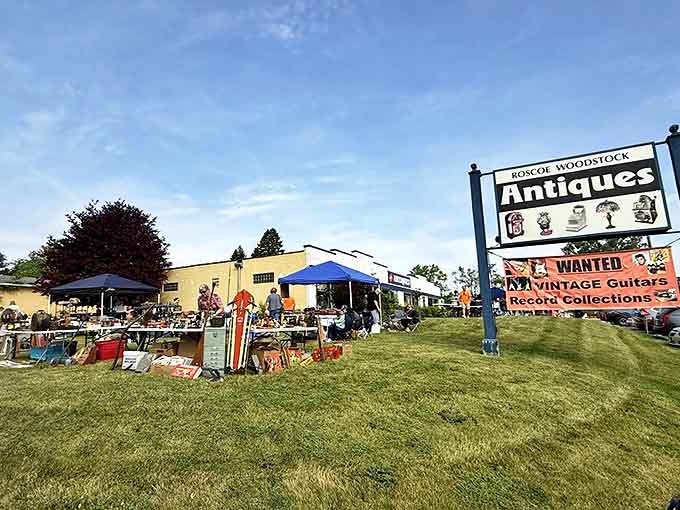 Outdoor signage announcing this antique wonderland to passing traffic, because some treasures are too good to keep secret from the highway.