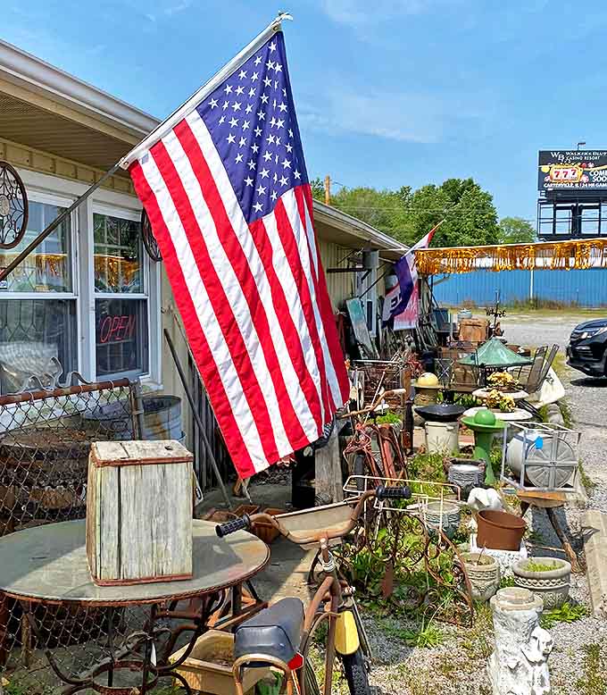 The American flag proudly waves outside Rosebud Antique Mall, where every item inside represents a small piece of our collective national story waiting to be rediscovered.