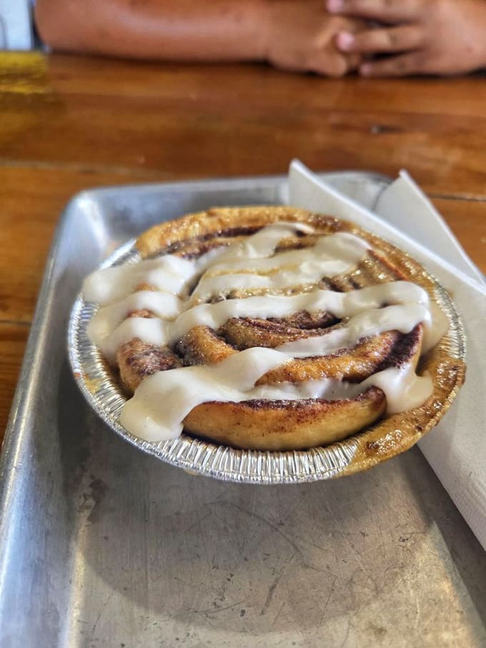 The cinnamon roll &ndash; a spiral of happiness with icing rivers flowing through valleys of cinnamon-sugar bliss.