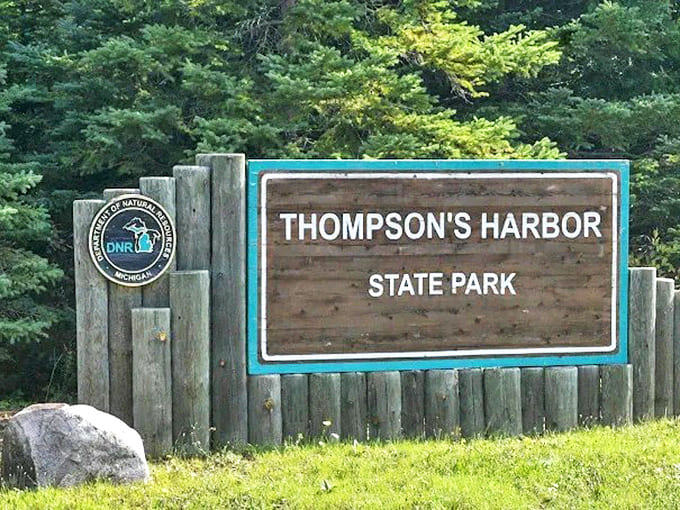 The weathered sign welcomes visitors to this maritime treasure, where history isn't just preserved behind glass but lives on in every authentic detail of this working lighthouse.