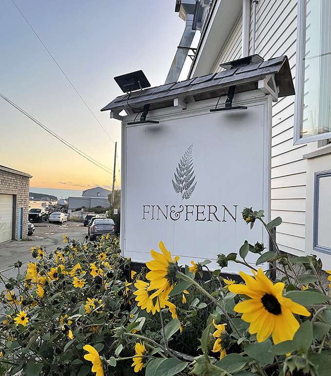 Sunflowers stand guard beneath the restaurant's elegant logo &ndash; this unassuming sign marks the spot where seafood dreams come true.