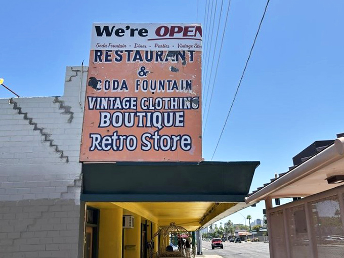More than just words on a board, this sign promises a multi-sensory journey through food, fashion, and the flavors of yesteryear.