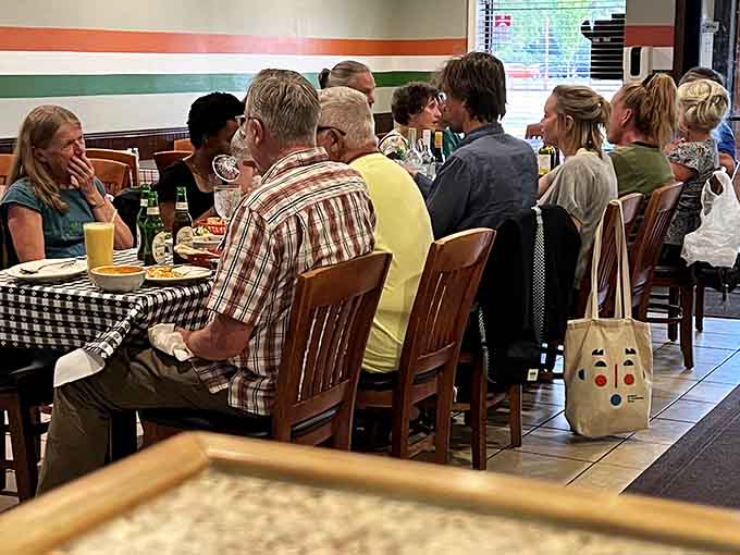 Happy diners sharing a communal experience &ndash; proof that great food brings people together across all cultural boundaries.