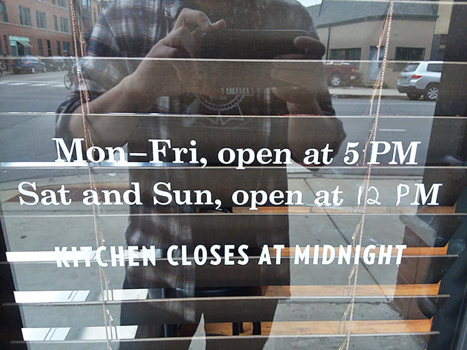 Store hours displayed on an ice cream cone—because even practical information deserves to be delightful. Open daily for your chocolate emergencies.