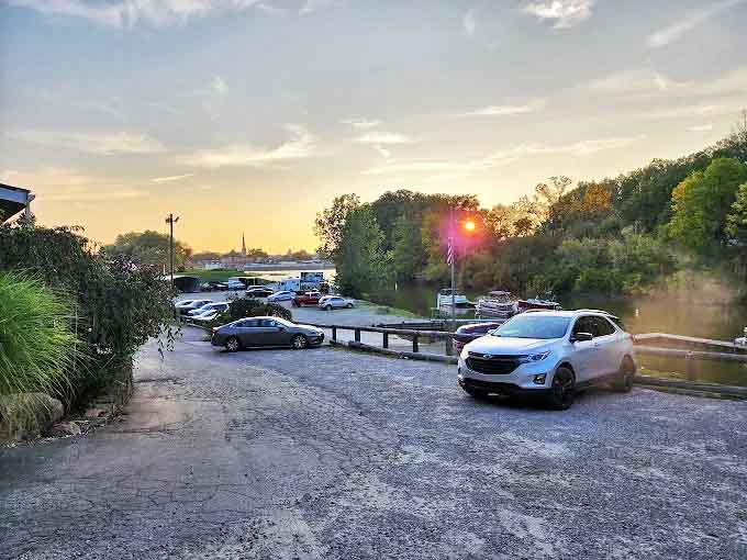 The sunset view from Tackle Box 2's parking lot &ndash; where the day's last light dances on the Sandusky River, promising tomorrow's adventures.