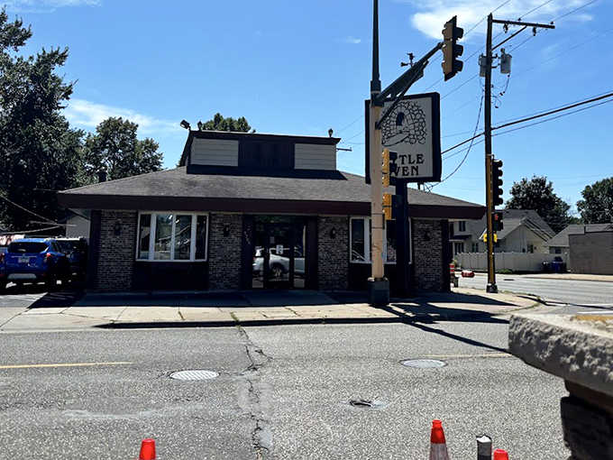 Sunlight bathes The Little Oven's exterior, highlighting the unassuming charm of this St. Paul institution that's fed generations.