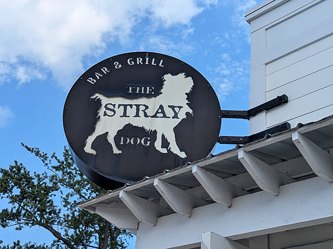 The iconic Stray Dog sign stands as a beacon for hungry travelers, promising good times and great food to all who follow its canine silhouette.